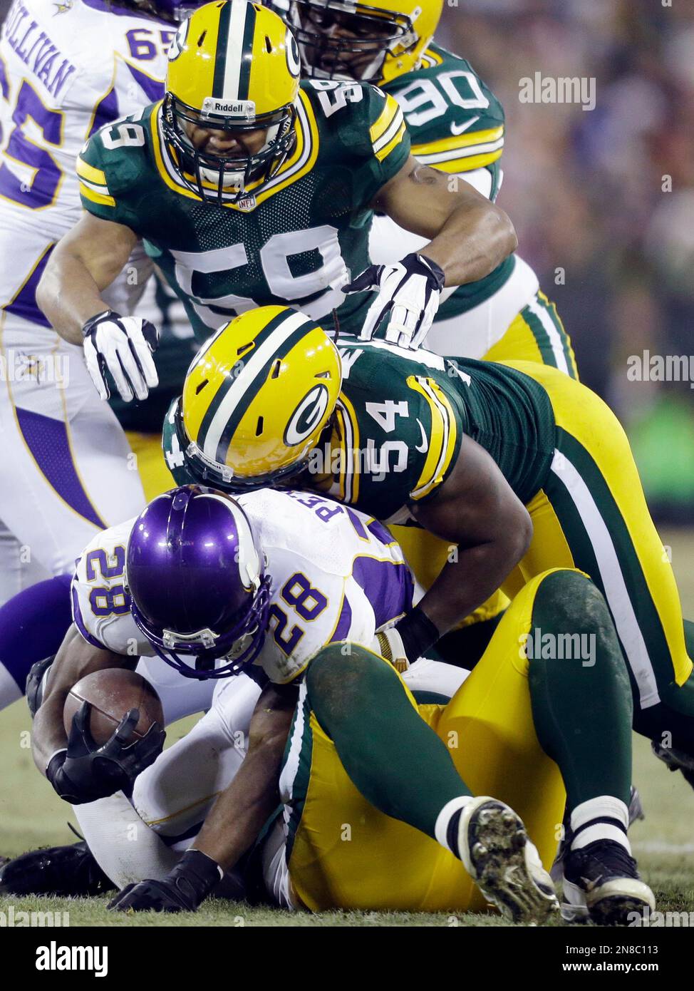 Minnesota Vikings running back Adrian Peterson (28) gets stopped by ...