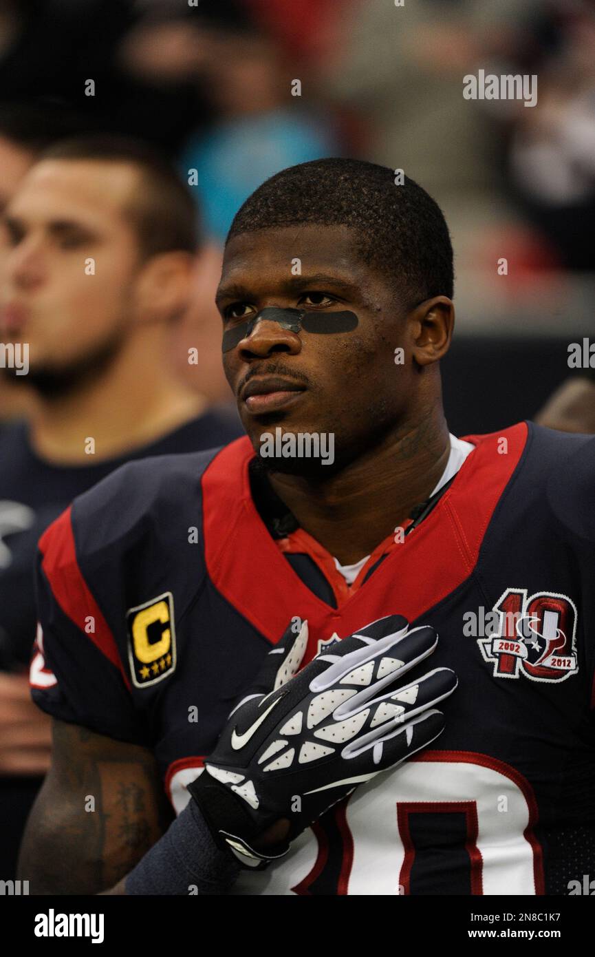 Houston Texans' Andre Johnson listens to the national anthem before an ...
