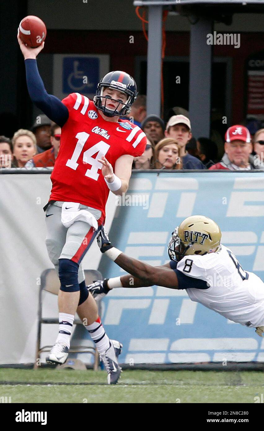 Mississippi quarterback Bo Wallace (14) throws while being pursued by ...