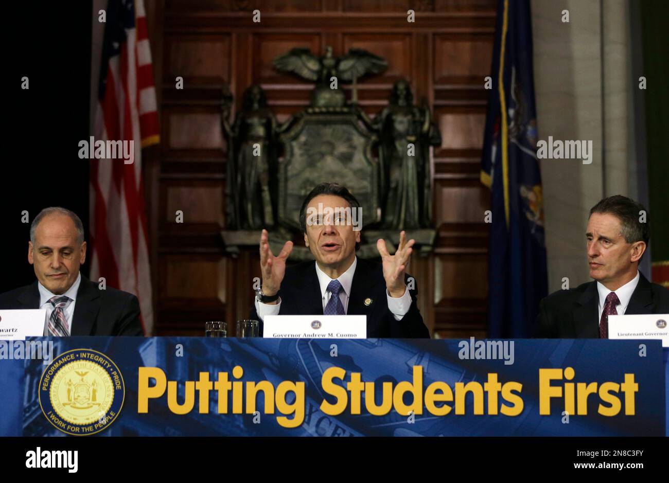 New York Gov. Andrew Cuomo, center, Chief of Staff Larry Schwartz, left ...