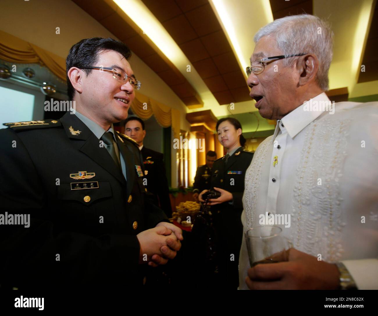 Philippine National Defense Secretary Voltaire Gazmin, right, and ...