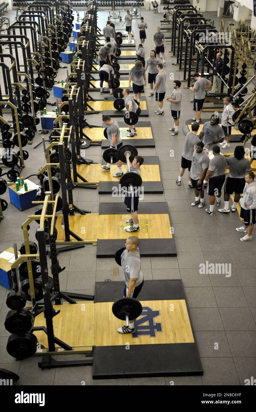 In this 2010 photo, Notre Dame football players work out in the weight ...