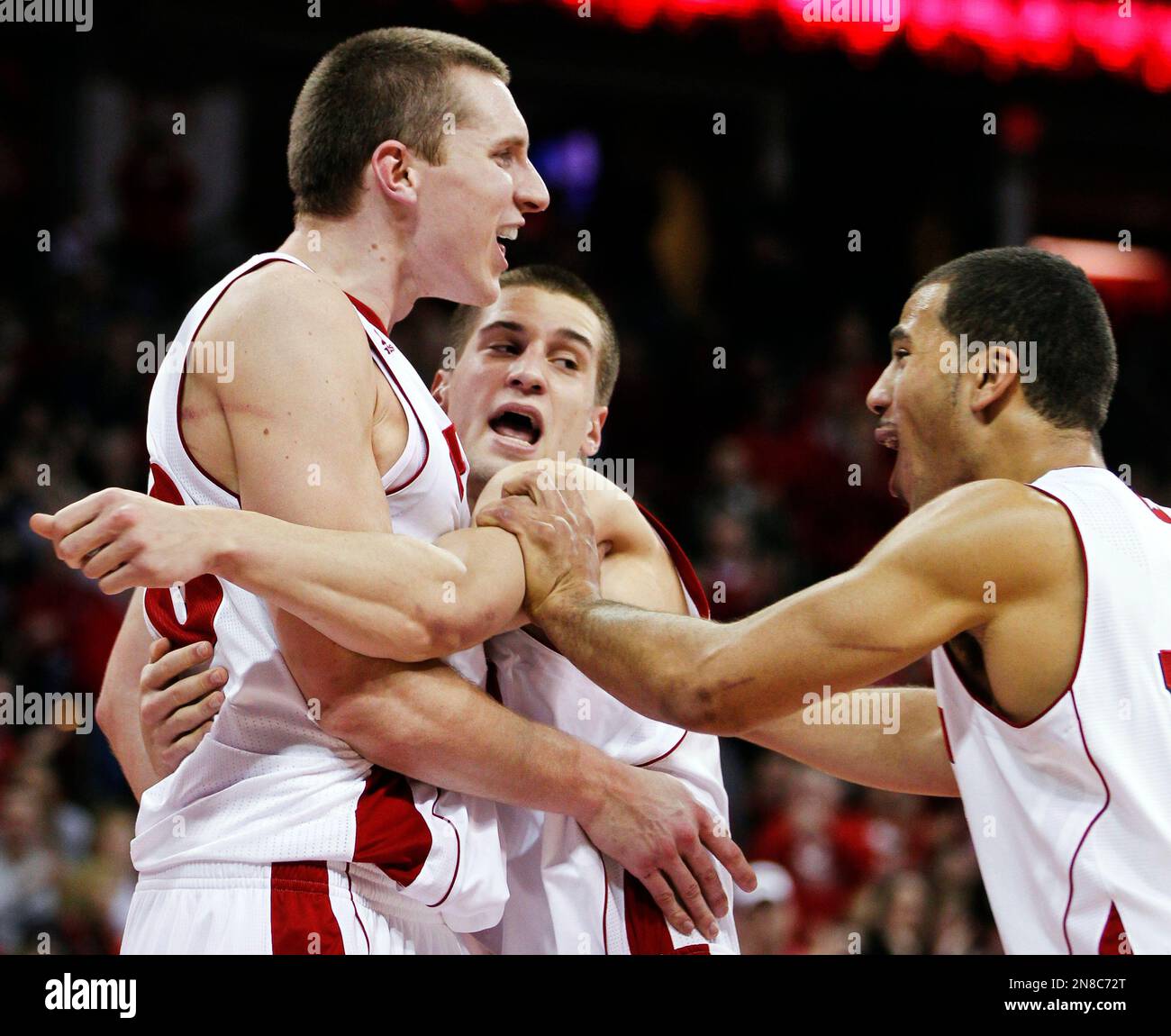 Wisconsin's Ben Brust, center, and Traevon Jackson, right, celebrate ...