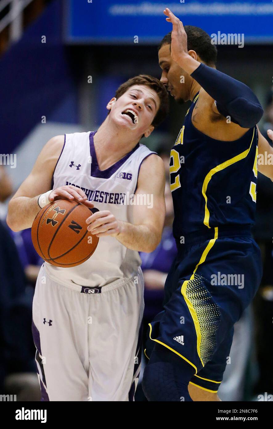 Michigan forward Jordan Morgan, right, guards Northwestern guard Dave ...