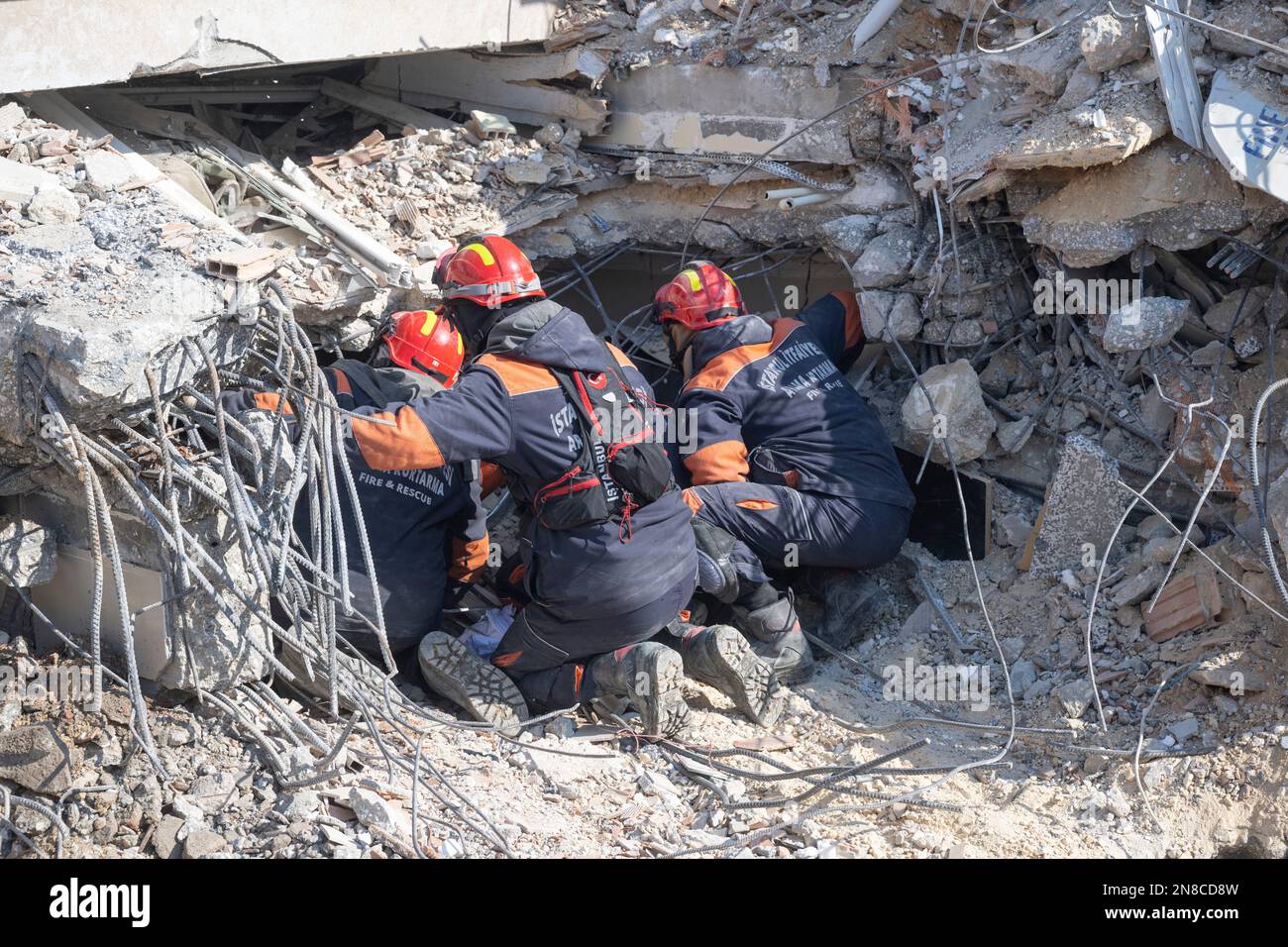 Antakya, Turkey. 11th Feb, 2023. Helpers have dug a tunnel to a buried ...