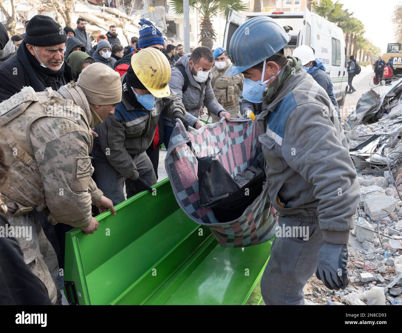 Antakya, Turkey. 11th Feb, 2023. Helpers recover a fatality from a ...