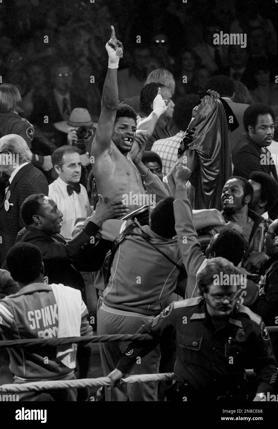 Leon Spinks, 24, is carried from the ring in Las Vegas after winning ...