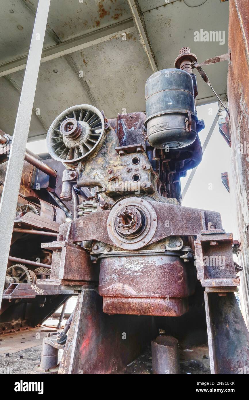 The rusty engine and mechanical parts of an old abandoned crane Stock ...