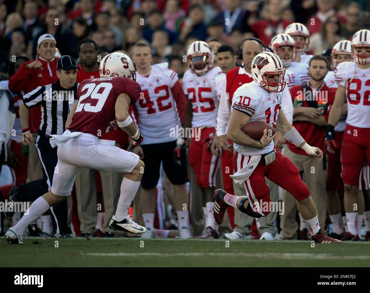 Wisconsin quarterback Curt Phillips runs past Stanford safety Ed ...