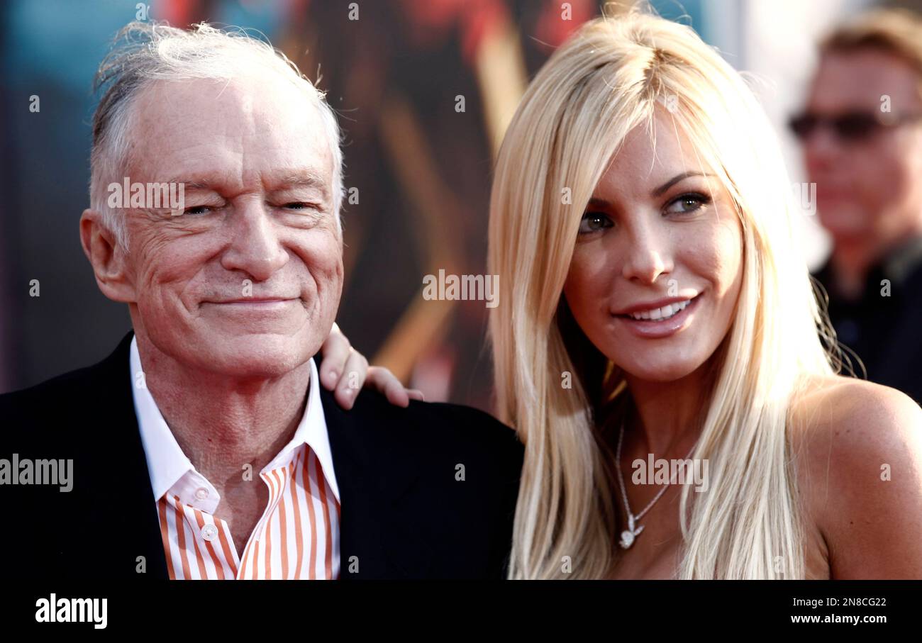 FILE - In this April 26, 2010 file photo, Hugh Hefner, left, and ...