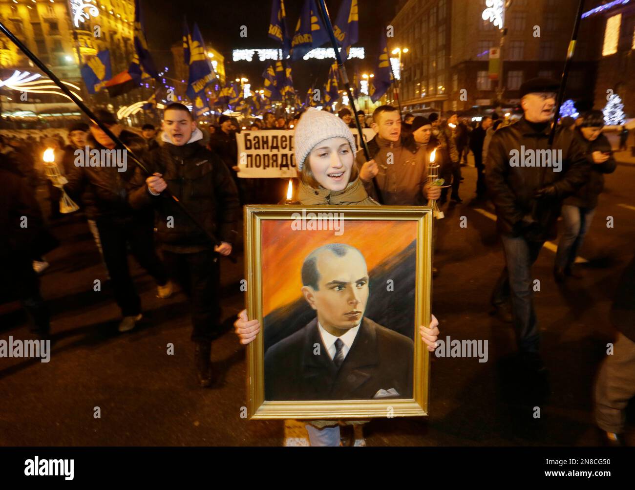 A Ukrainian nationalist carries a portrait of Stepan Bandera, founder ...