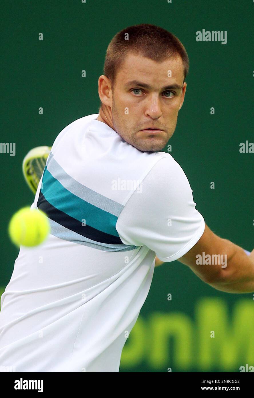 Russia's Mikhail Youzhny returns the ball to Benjamin Becker of Germany ...