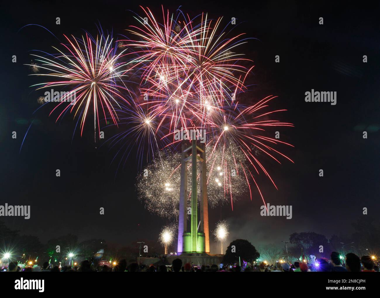 Spectators watch a fireworks display at the Quezon Memorial Circle in ...