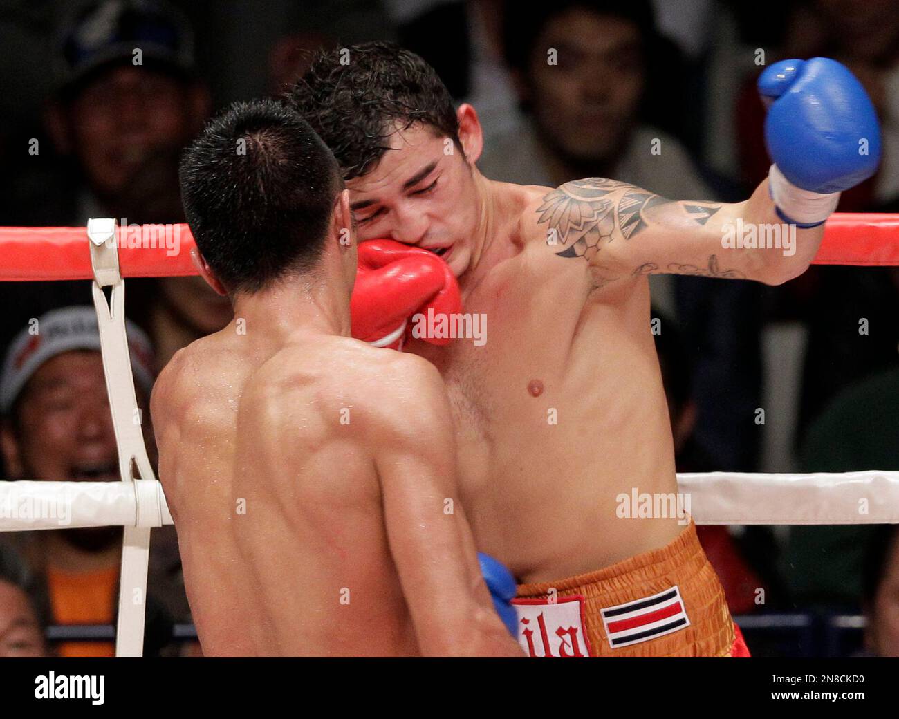 Costa Rican challenger Bryan Vasquez, right, gets a punch by Japanese ...