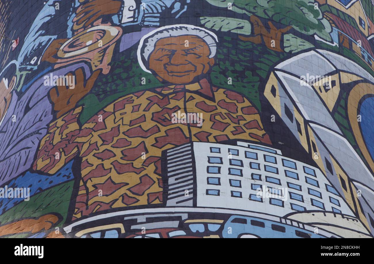 A giant portrait of former president Nelson Mandela adorns a cooling ...