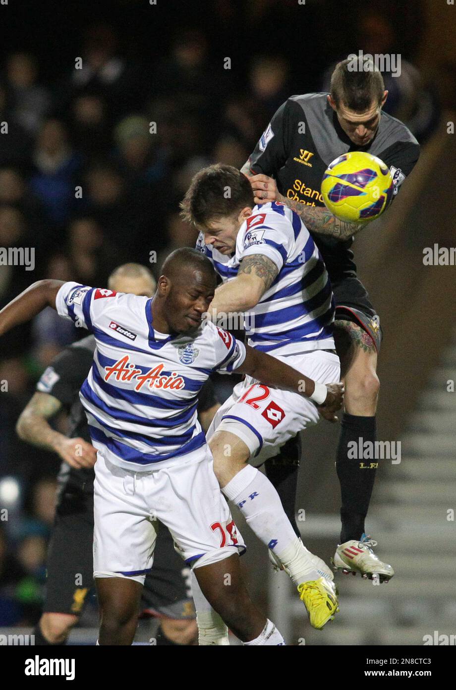 Liverpool's Daniel Agger, right, competes with Queens Park Rangers ...