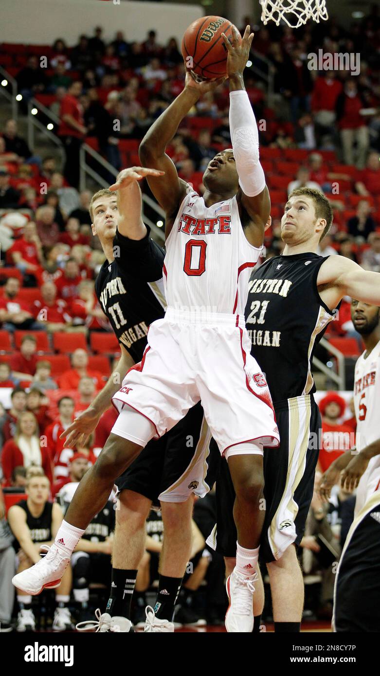 North Carolina State's Rodney Purvis (0) gets his shot off despite the ...