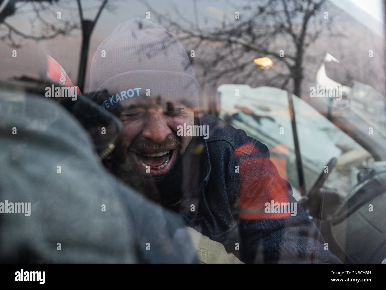 Adana, Turkey, Turkey. 11th Feb, 2023. A father rejoices after his ...