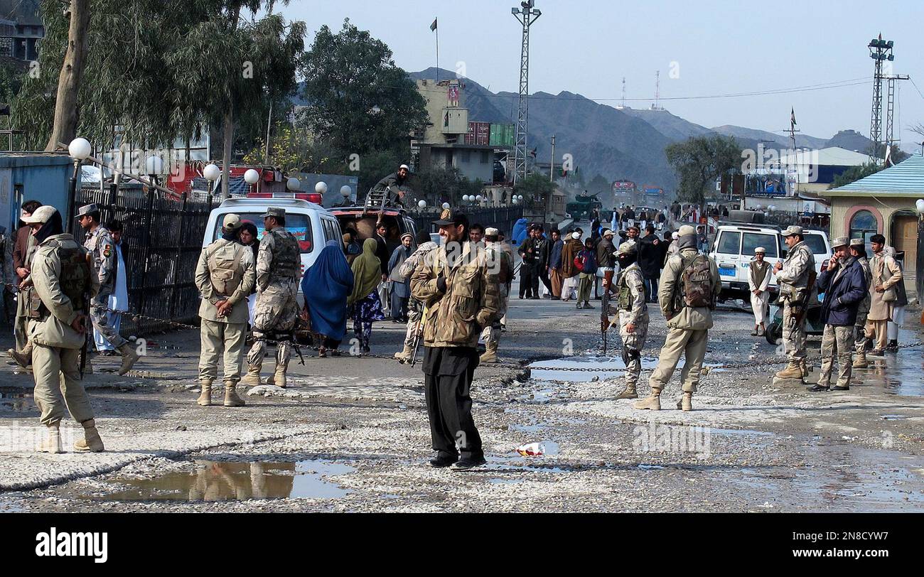 Pakistani border security personnel stand guard at a border crossing ...