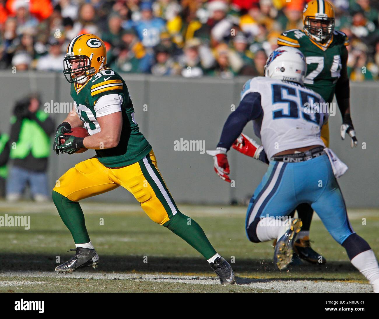 Green Bay Packers fullback John Kuhn rushes against the Tennessee ...