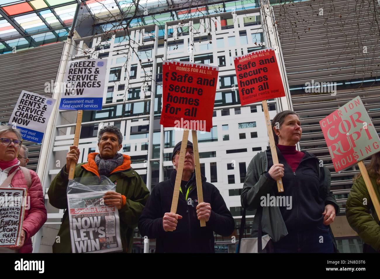 London, UK. 11th Feb, 2023. Protesters hold placards demanding a freeze ...