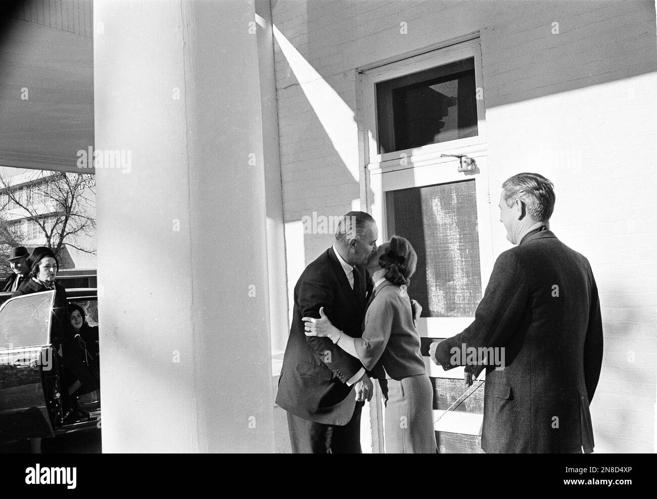 President Lyndon B. Johnson kisses Nellie Connally, first lady of Texas ...