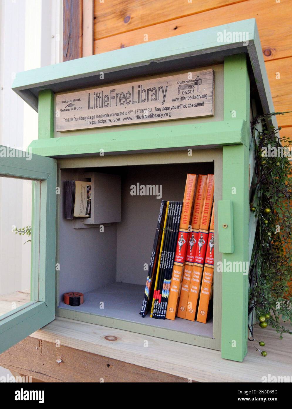 In this Thursday, Dec. 6, 2012 photo, one of the Little Free Libraries ...