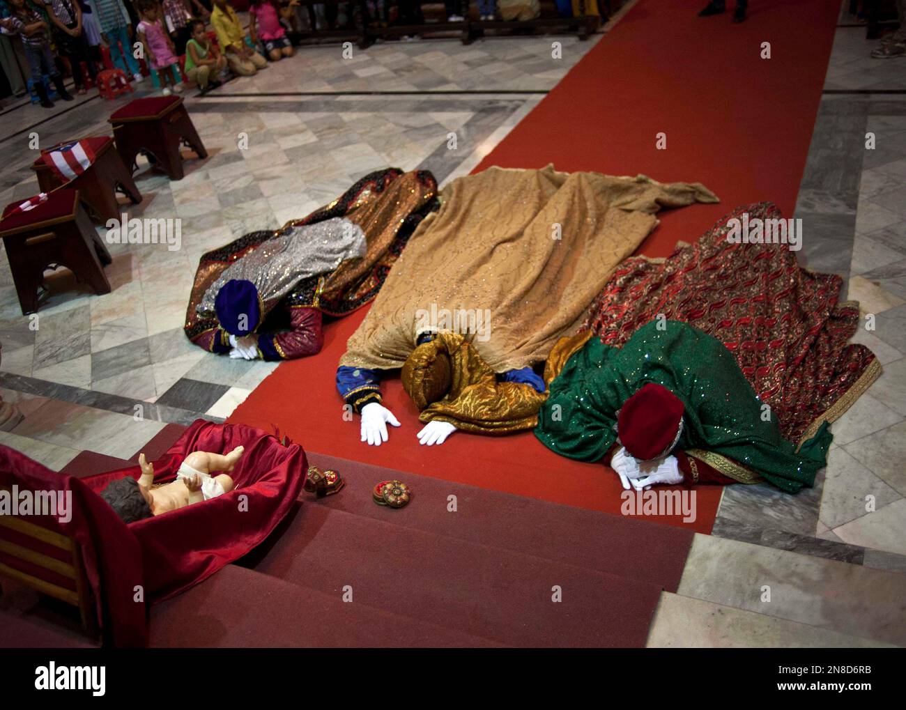 Puerto Rican citizens perform as the Three Kings during a Mass to ...