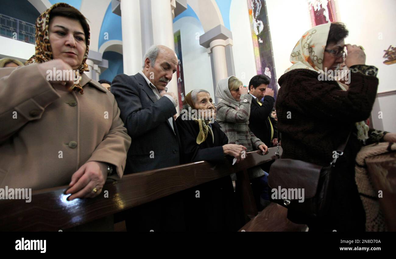 Iranian Christian worshippers pray during Christmas mass at the Saint ...