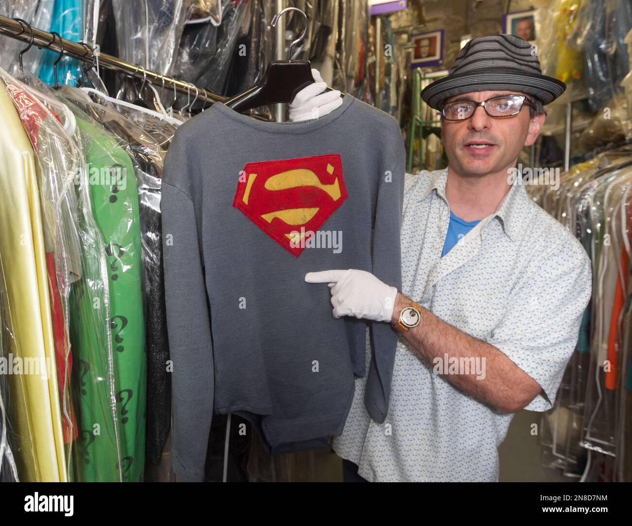 In this Friday, Nov. 30, 2012 photo, James Comisar holds the costume ...