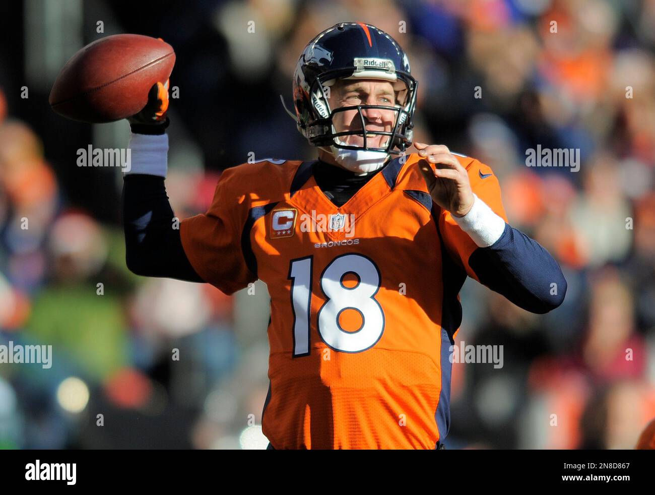 Denver Broncos quarterback Peyton Manning sets to throw a pass in the ...