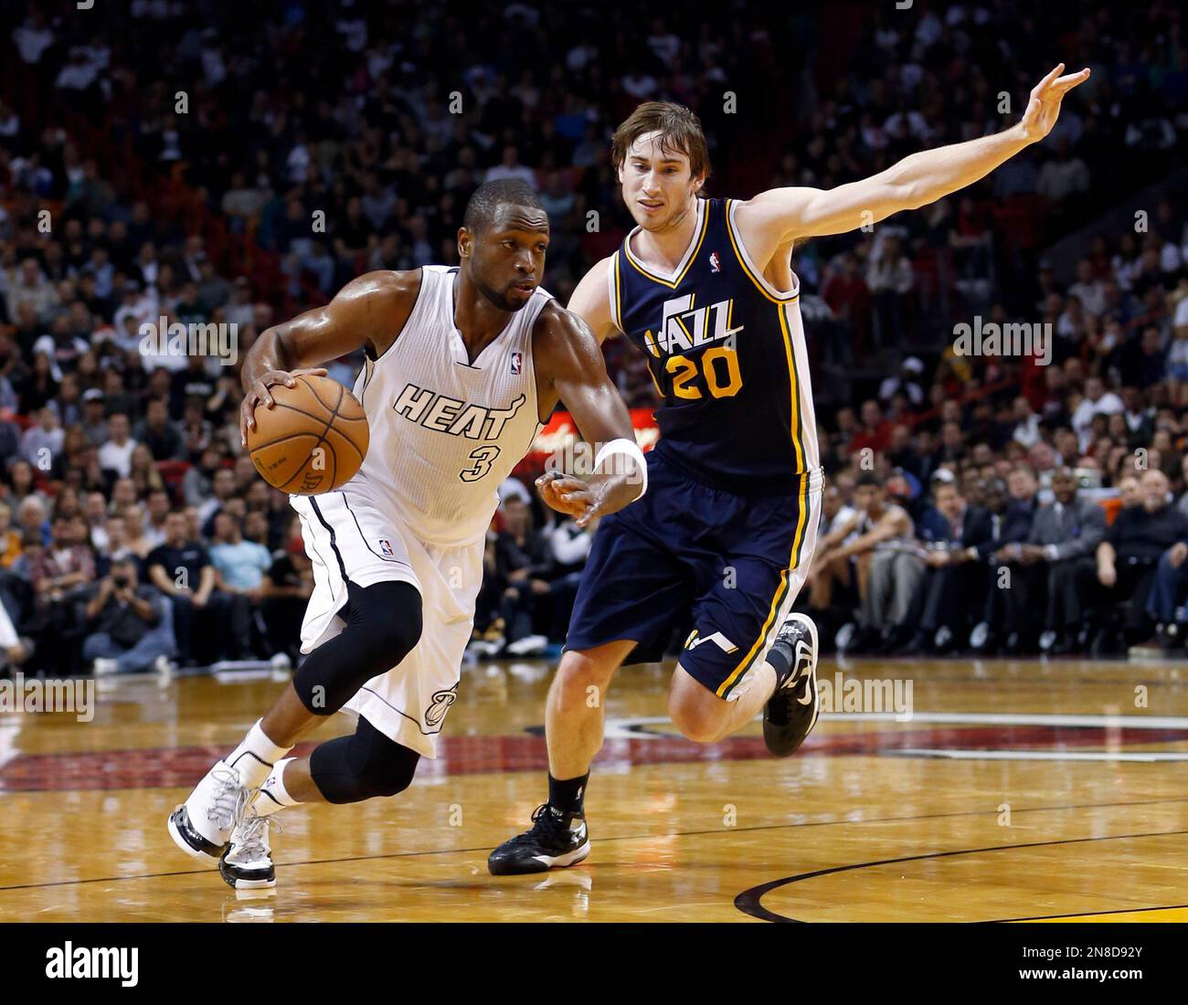 Miami Heat's Dwyane Wade (3) drives against Utah Jazz's Gordon Hayward ...