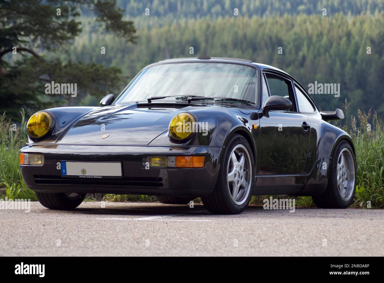 A luxury black vintage Porsche 911 RUF car parked on the street Stock ...