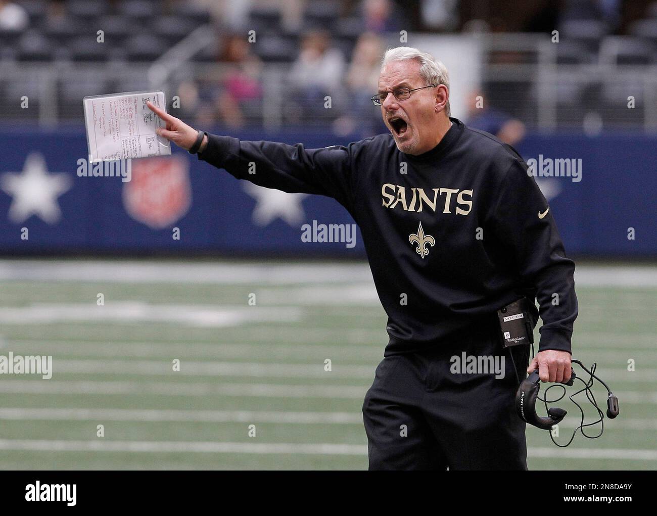 New Orleans Saints acting head coach Joe Vitt yells from the sidelines ...
