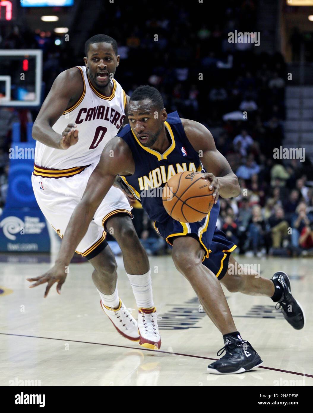 Indiana Pacers' Sam Young, right, drives past Cleveland Cavaliers' C.J ...