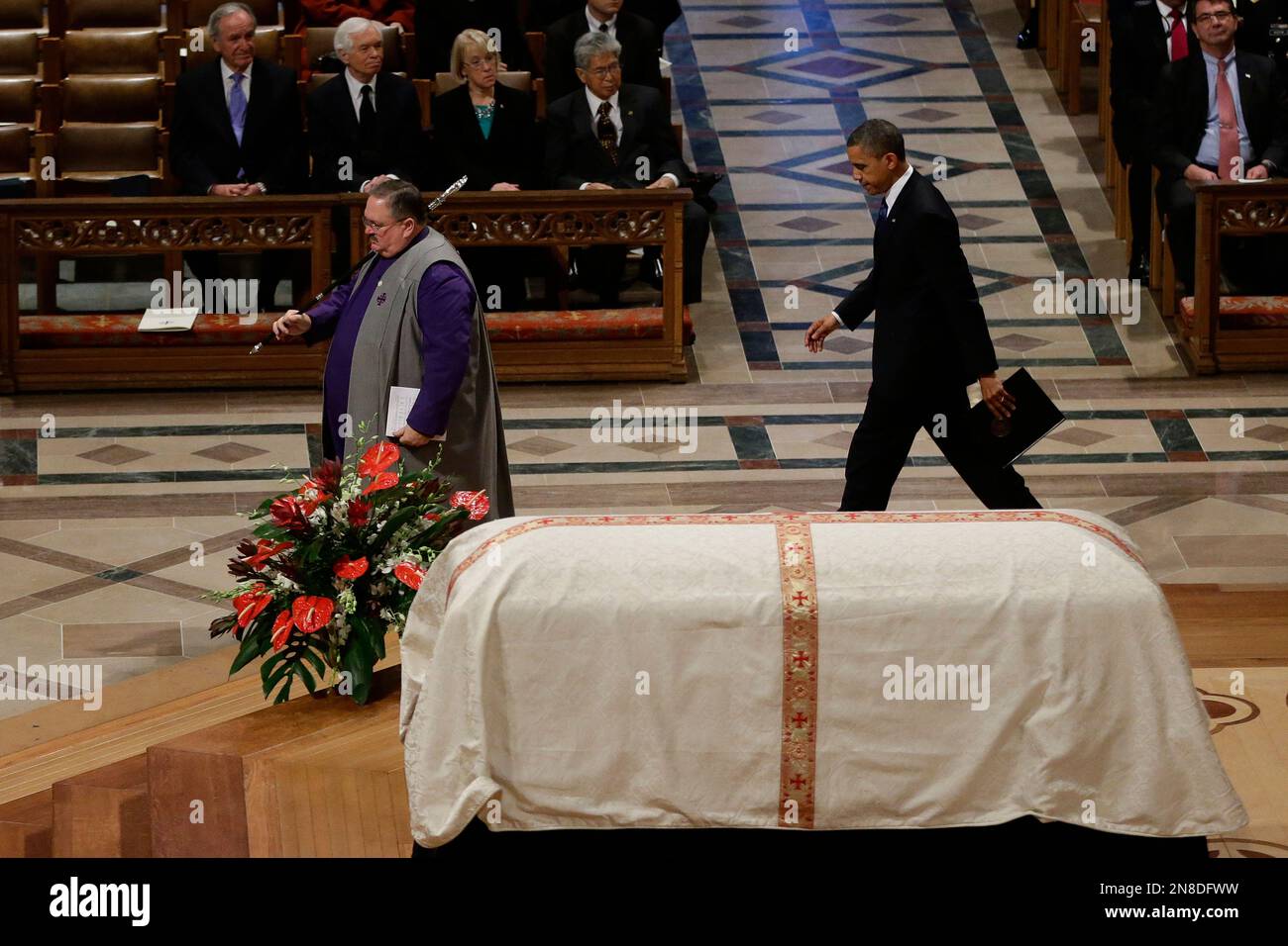 President Barack Obama, walks past the casket of the late Sen. Daniel ...