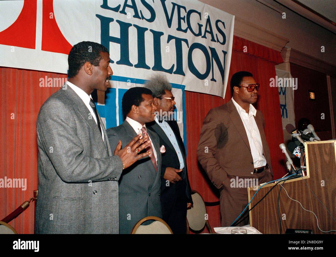 Larry Holmes, right, ignores antics of Michael Spinks, left, during ...