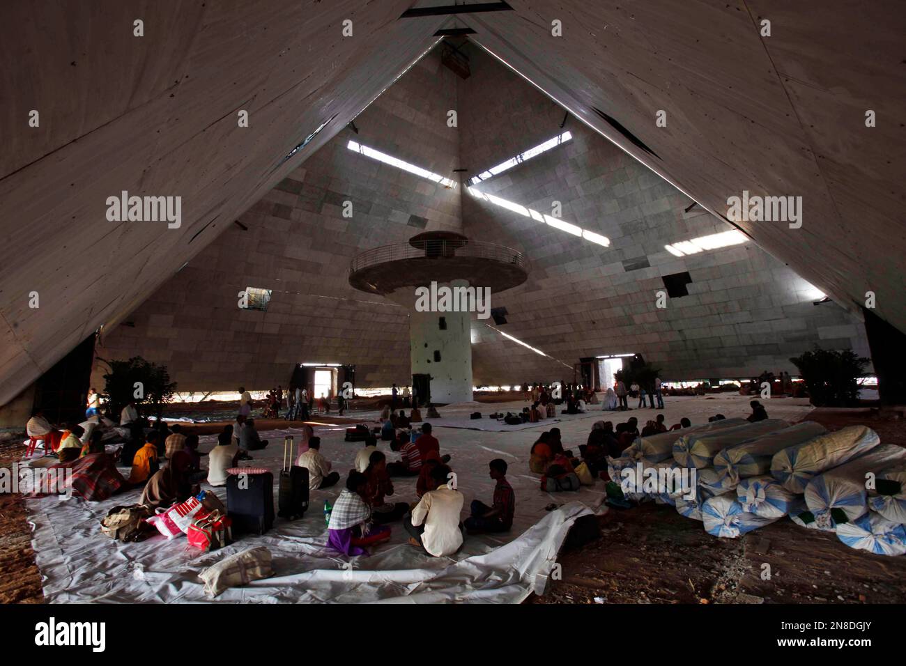 Indian devotees meditate inside the Maheshwara Pyramid on the outskirts ...