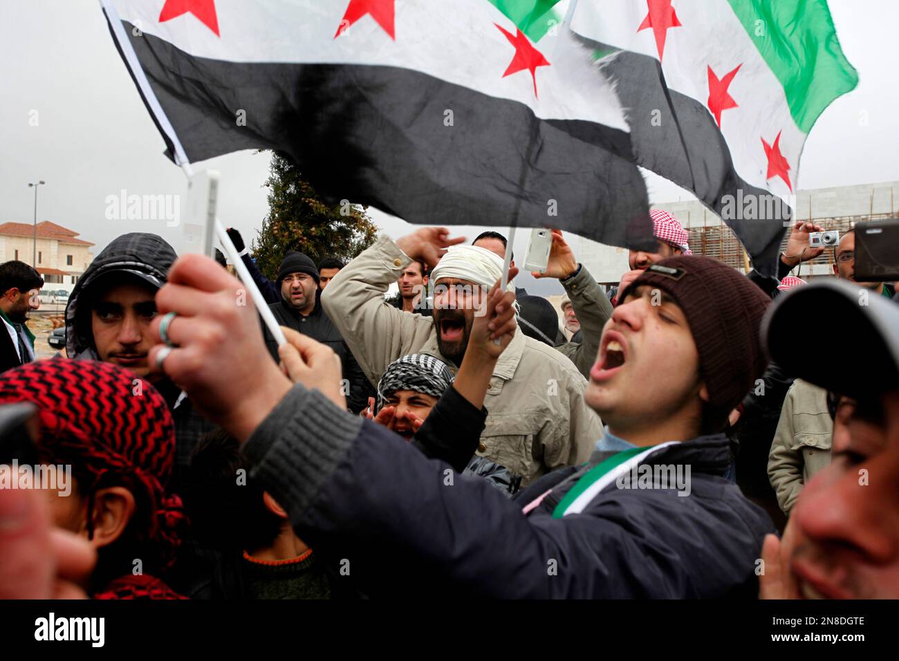 Syrians chant anti-Bashar Assad slogans in front of the Syrian embassy ...