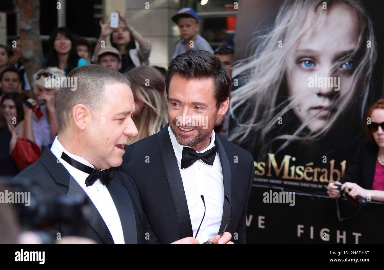 Actors, Hugh Jackman, right, and Russell Crowe, chat as they walk down ...