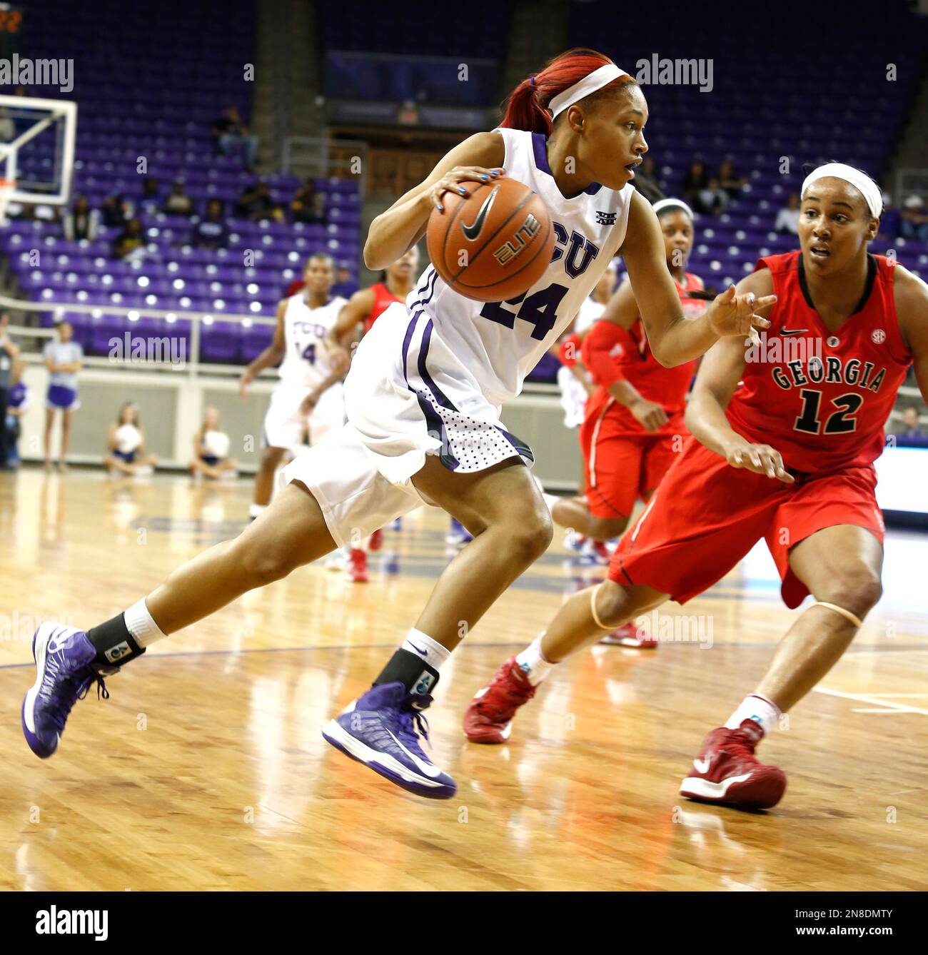 TCU guard Natalie Ventress (24) drives to the basket as Georgia forward ...