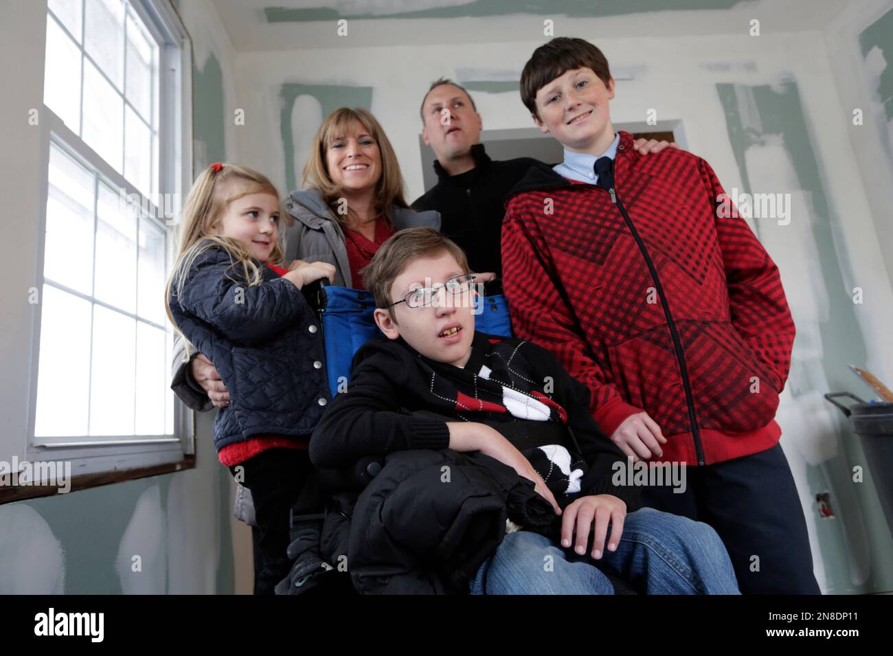 The Troy family poses for a group photo in their Long Beach, N.Y., home ...