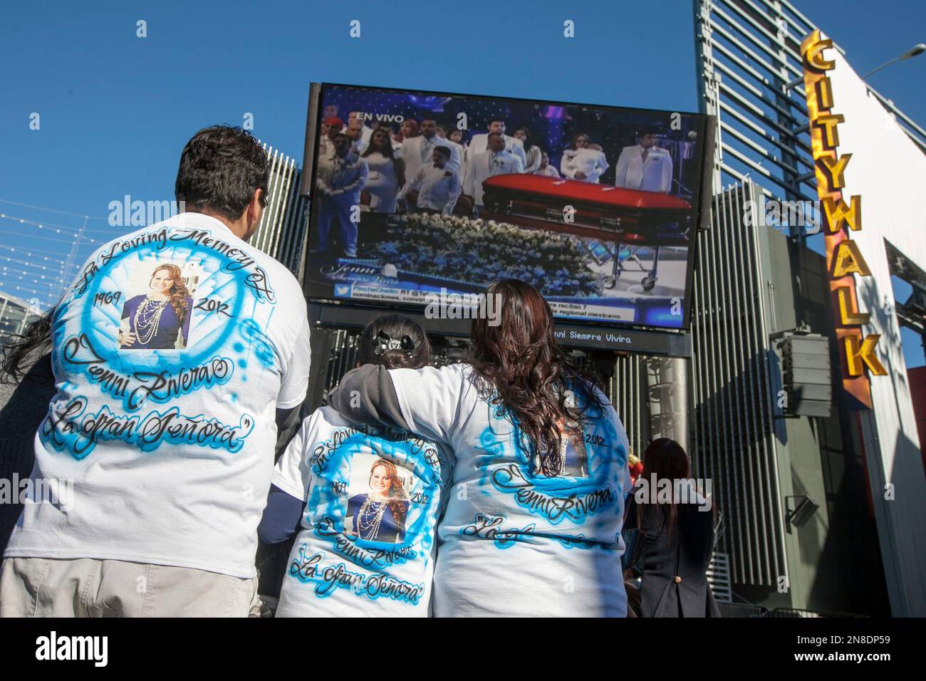 Fans mourn Jenni Rivera at a memorial televised a on giant television ...