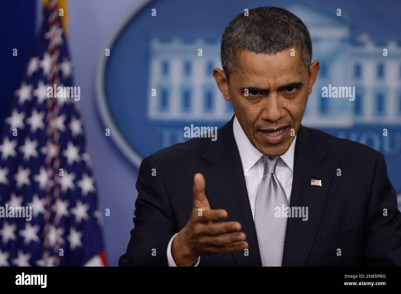 President Barack Obama gestures as he answers a question about the ...