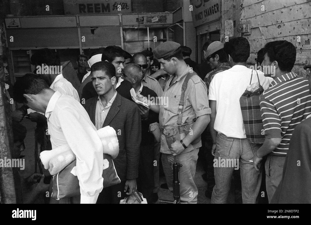 Arabs passing from inside the old city through Damascus gate have their ...