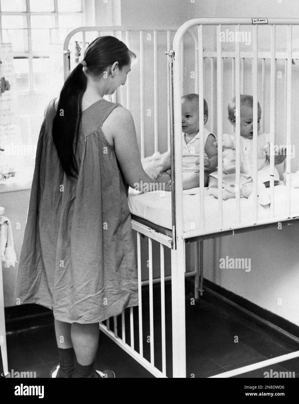 Jane, an inmate, spends time with her twins, Sandra and Donald, at the Westfield State Farm ...