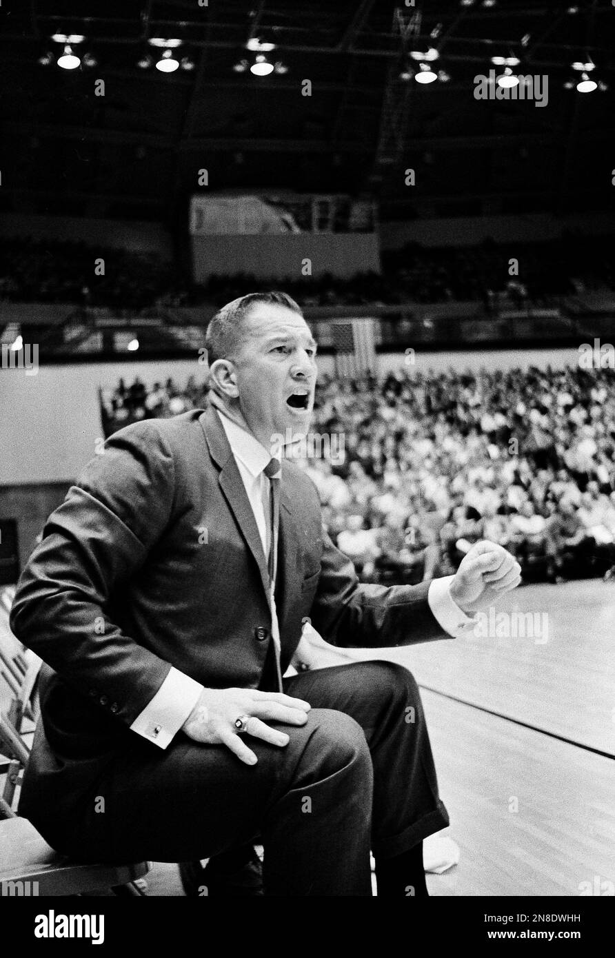 Larry Costello, coach of the Milwaukee Bucks shouts encouragement to ...