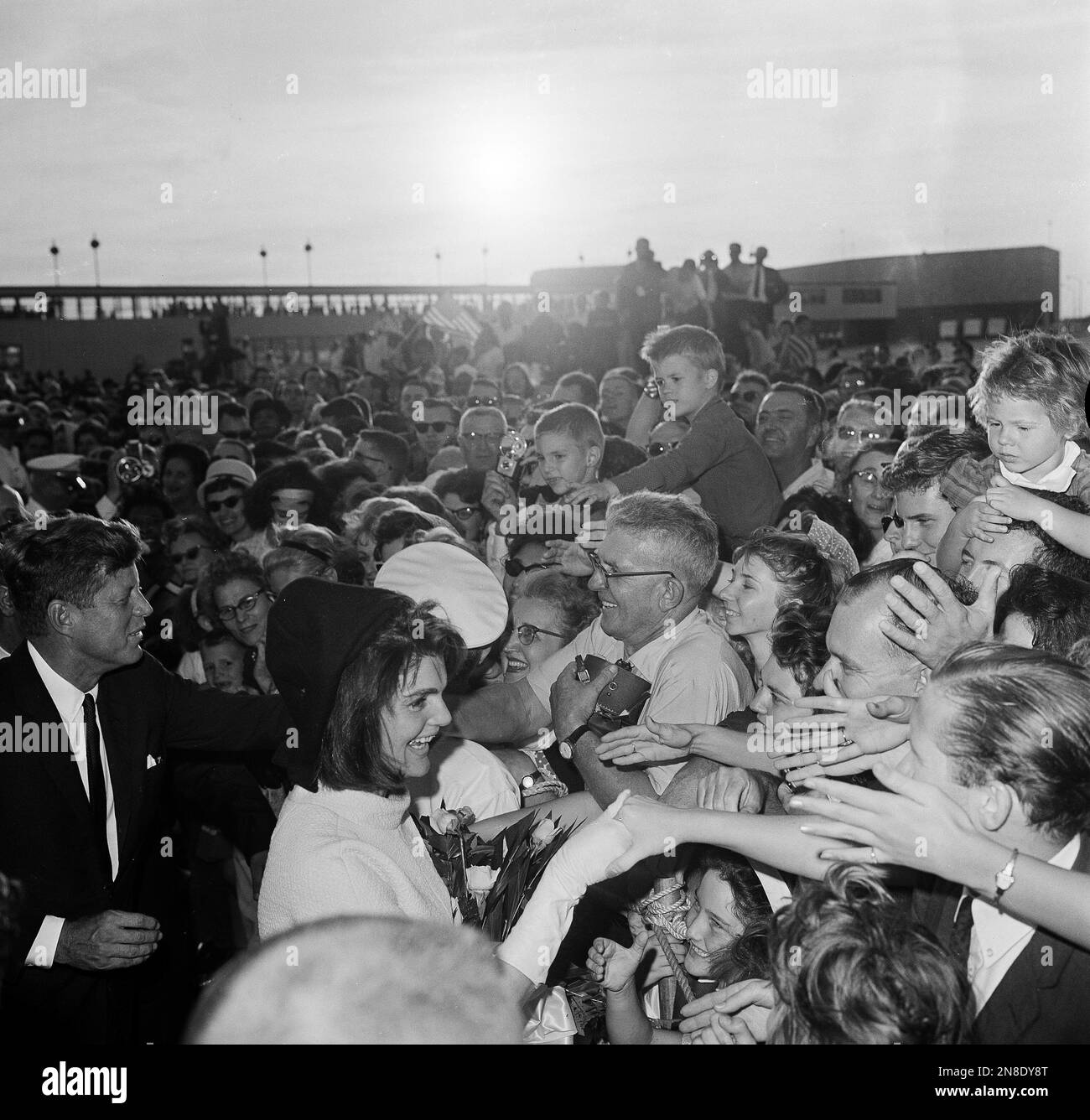 President John F. Kennedy and first lady Jacqueline Kennedy shake hands ...