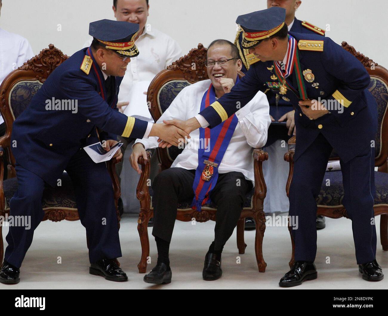 Philippine President Benigno Aquino III, center, smiles as new ...
