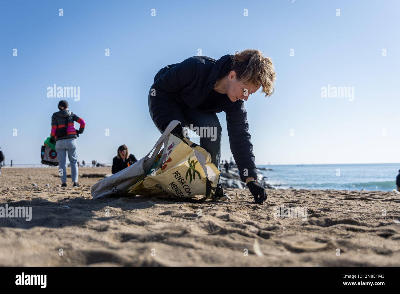 Barcelona, Spain. 11th Feb, 2023. A volunteer looking for plastics in ...